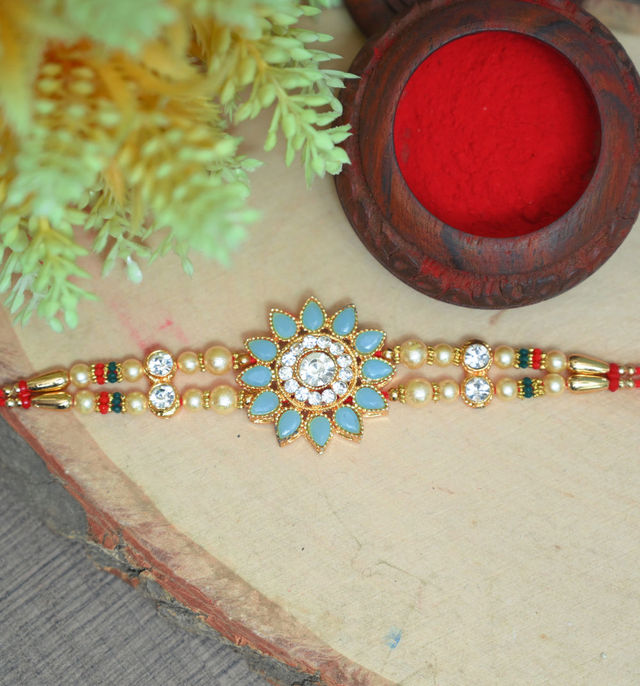 Buy Aurum Kundan Rakhi with Blue and Golden Stones - Elegant Design ...