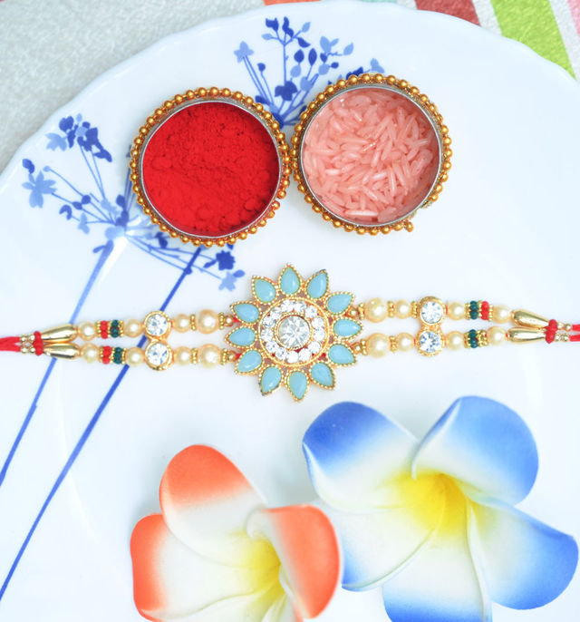 Buy Aurum Kundan Rakhi with Blue and Golden Stones - Elegant Design ...
